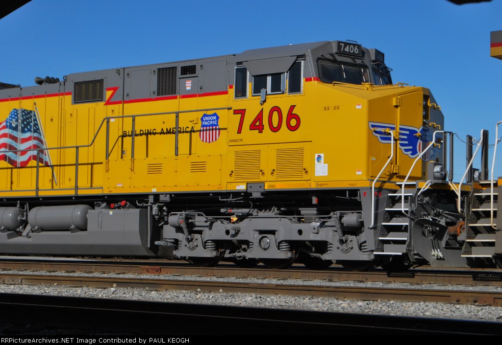 UP 7406 brand new C45ACCTE/ES44AC close up cab shot of the new left side crew entrance door.